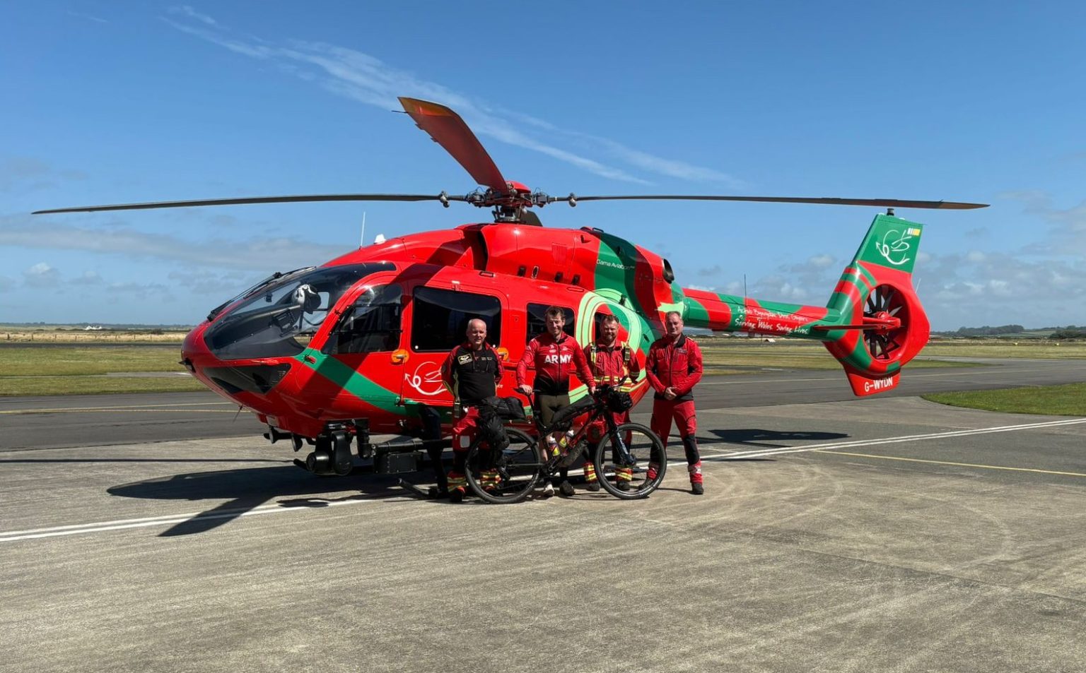 Wales Air Ambulance welcomes cyclist to bases in North and South as he ...